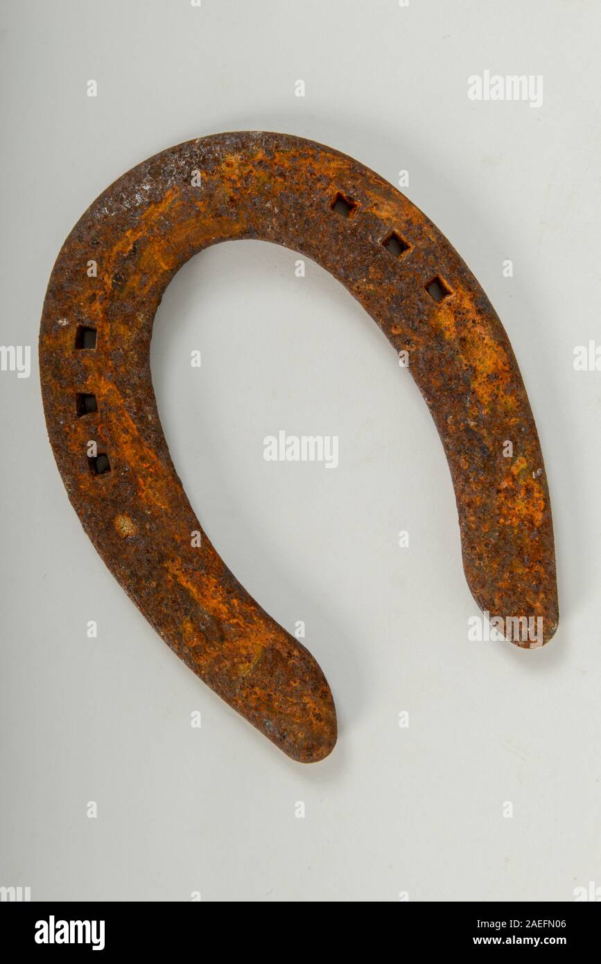 Old rusty horseshoe isolated on white Stock Photo - Alamy