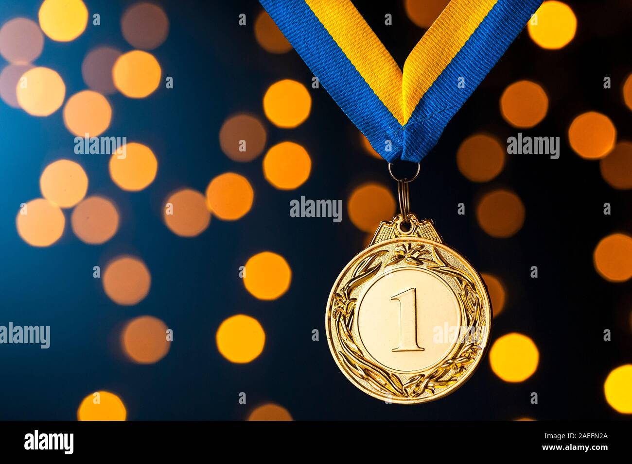 Gold champion or winners medallion on a ribbon Stock Photo - Alamy
