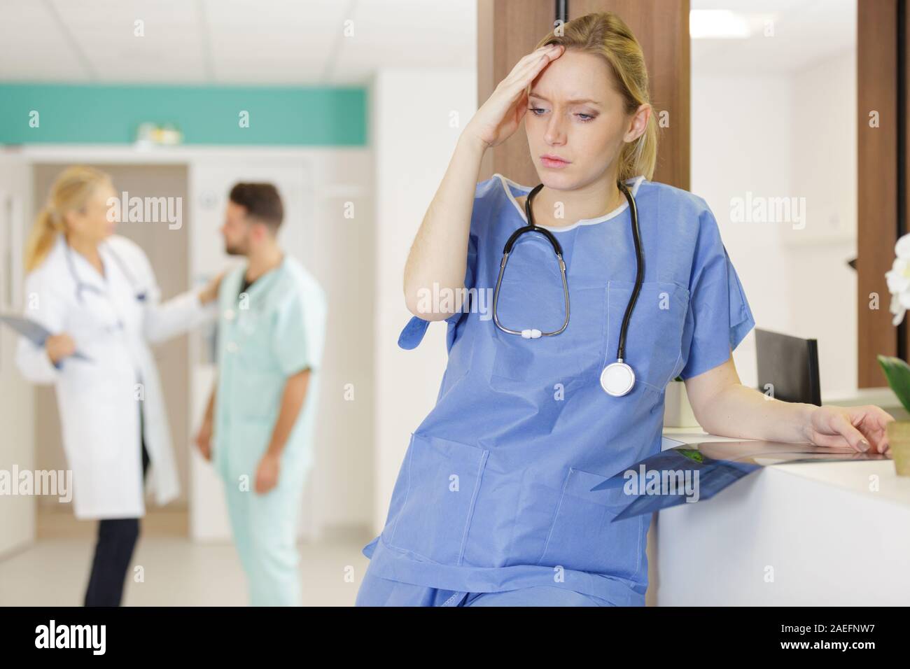 female doctor tired in hospital Stock Photo - Alamy