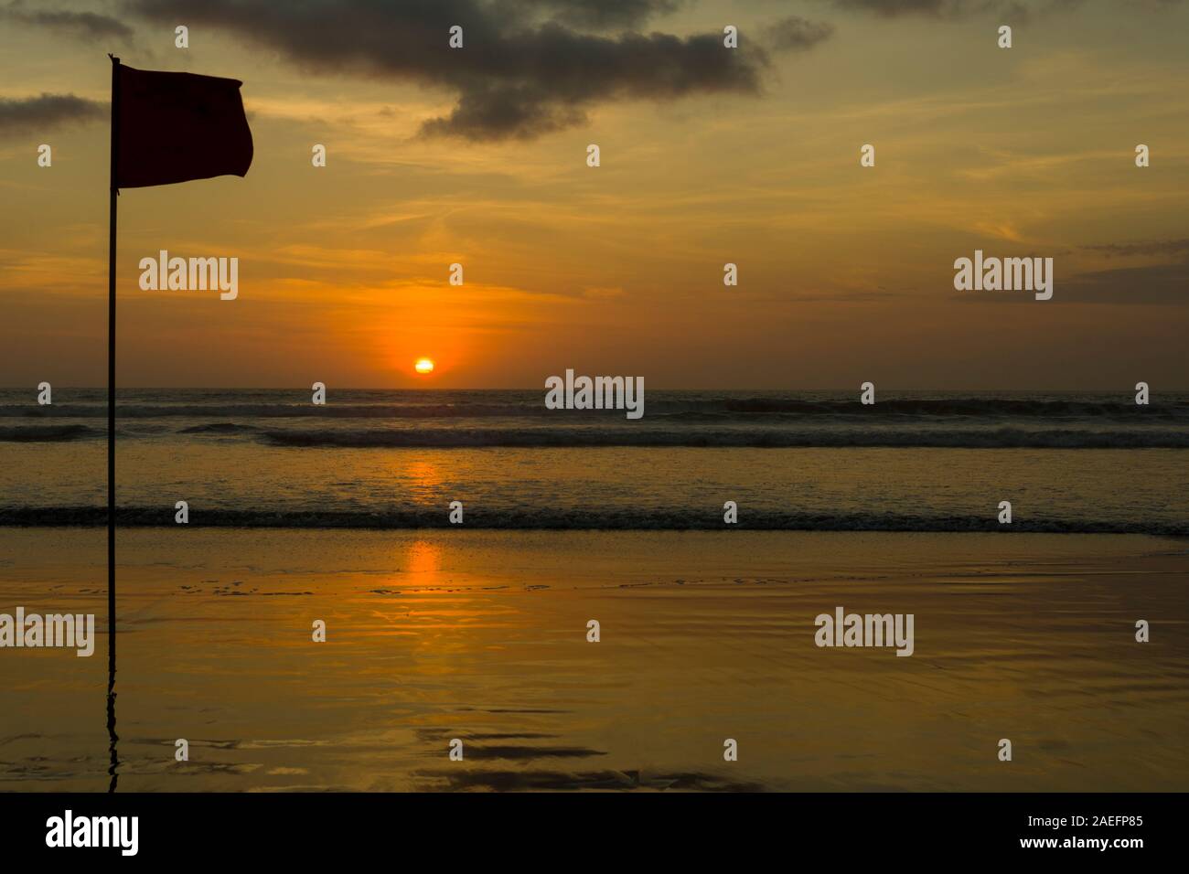 Silhouettes of a Flag on Kuta Beach at Sunset, Double Six Beach ...