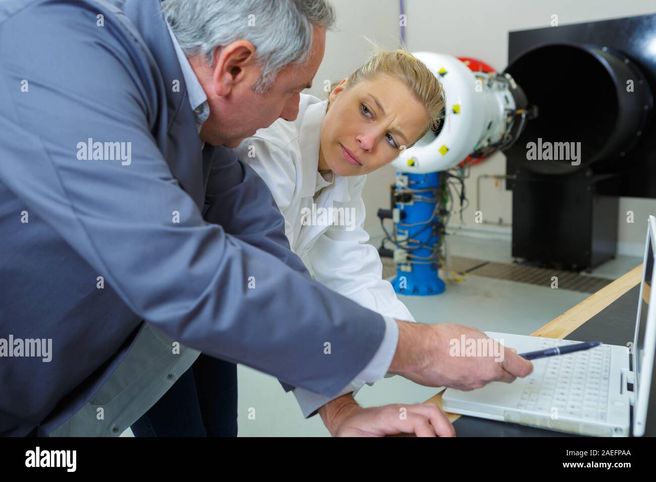 turbo robotic engineers at work Stock Photo - Alamy