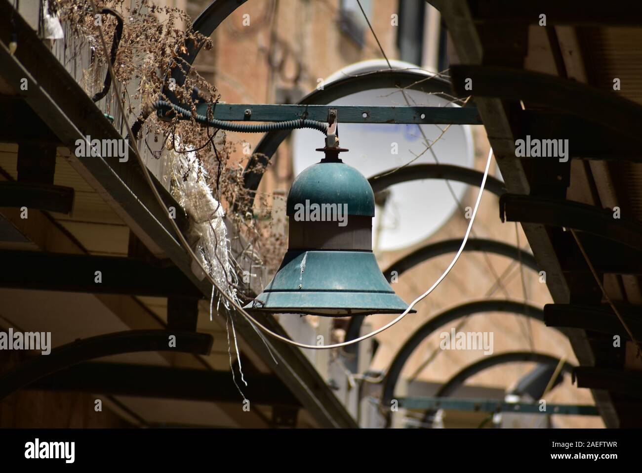 Green Bell hanging above the Streets of Nazareth Stock Photo - Alamy