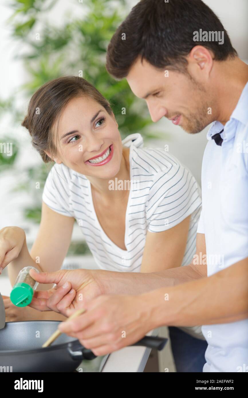 loving couple cooking together in the kitchen at home Stock Photo - Alamy