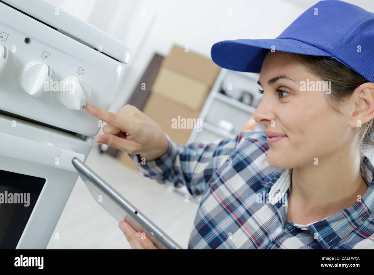 technician working in an oven factory Stock Photo - Alamy