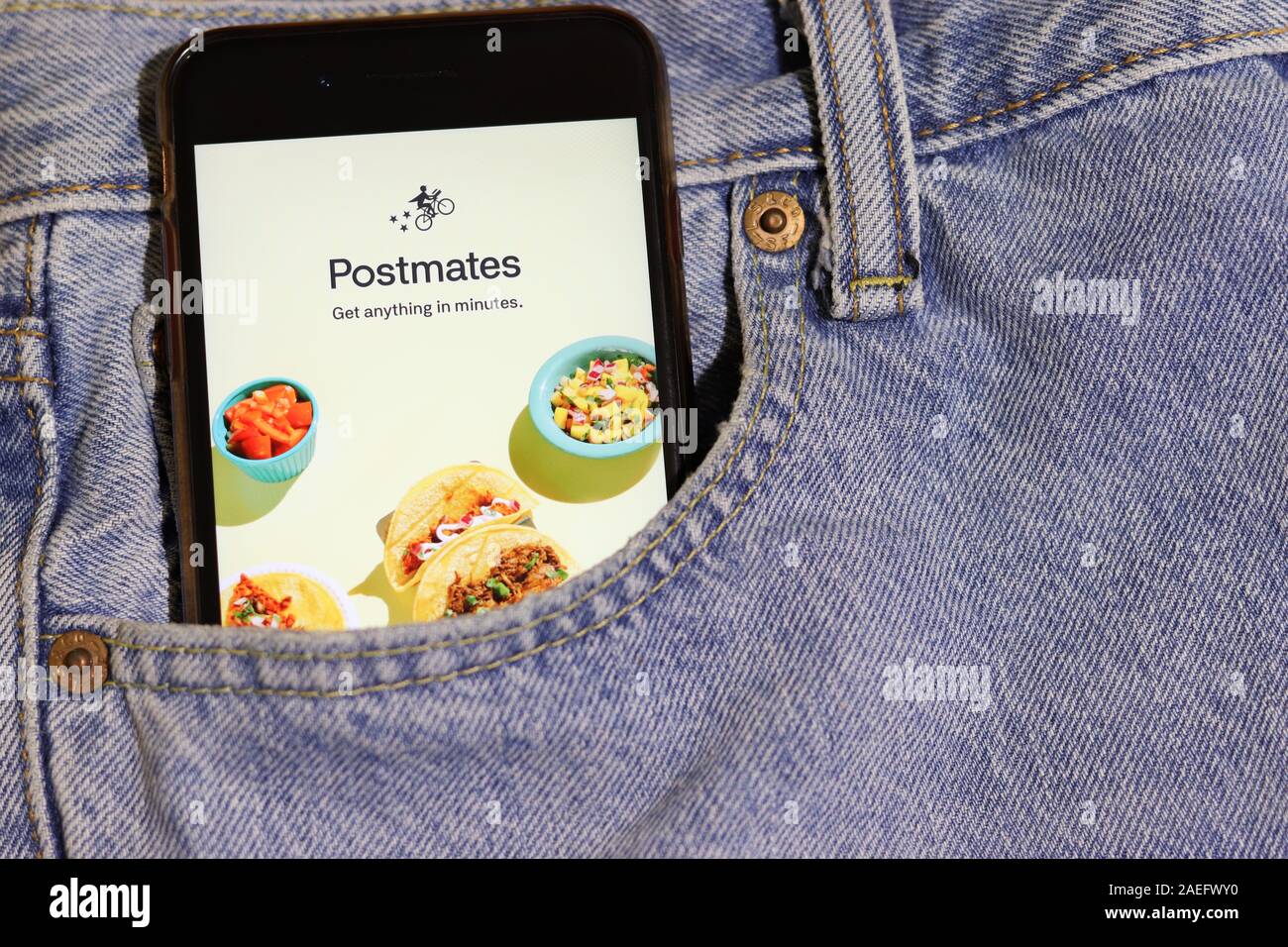 Los Angeles, USA - 10 March 2020: Phone with Postmates app logo in ...