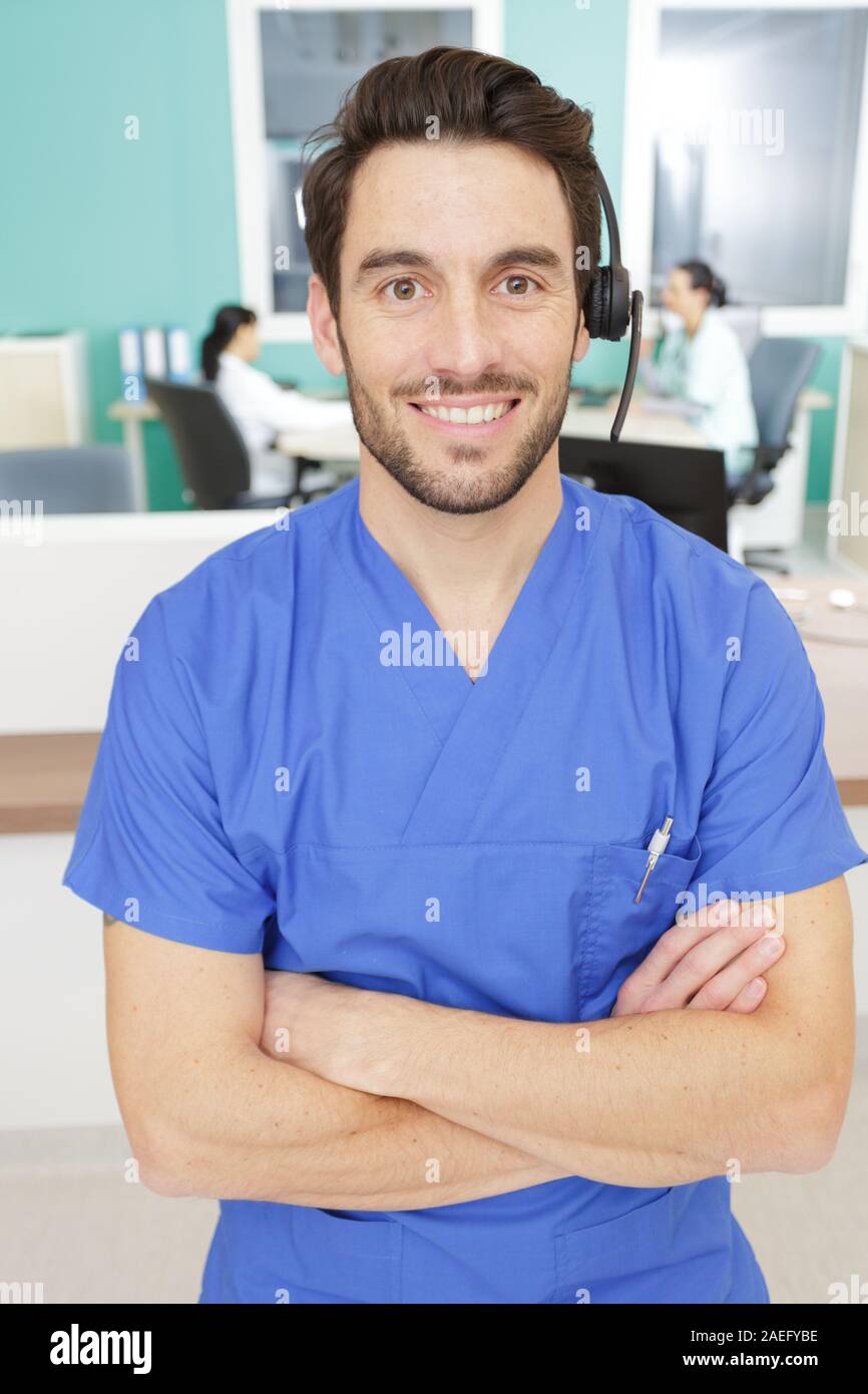 portrait of male medical secretary wearing headset Stock Photo - Alamy