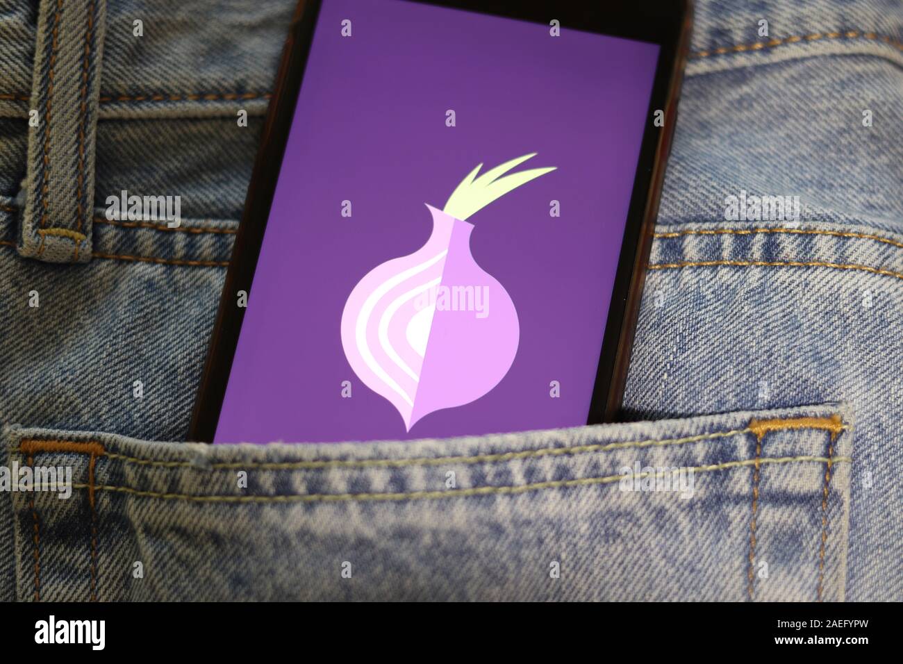 Los Angeles, USA - 10 March 2020: Phone with TOR app logo in denim ...