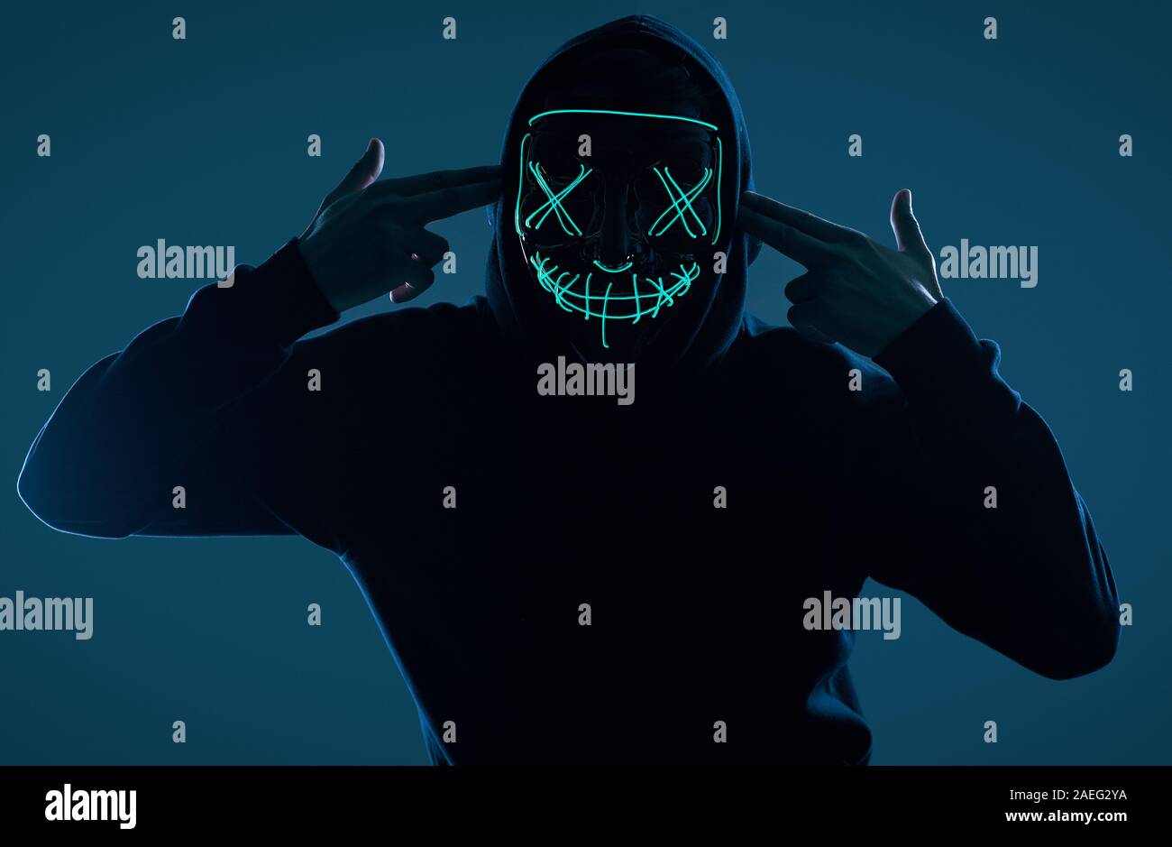 Black man hiding identity behind mask hi-res stock photography and ...