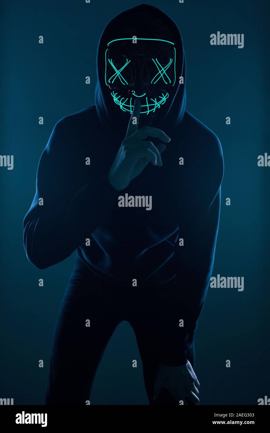 Black man hiding identity behind mask hi-res stock photography and ...