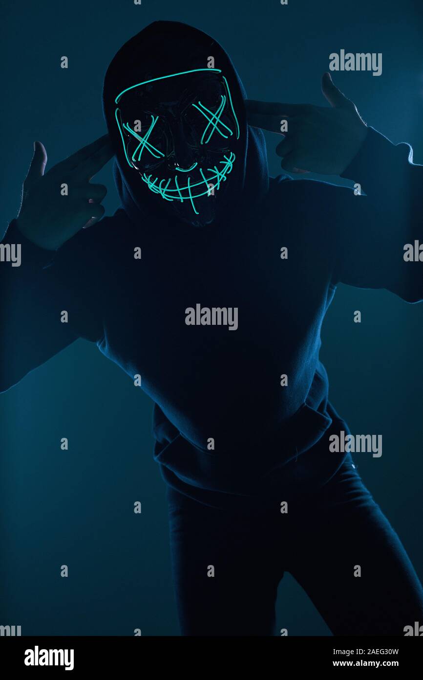 Black man hiding identity behind mask hi-res stock photography and ...