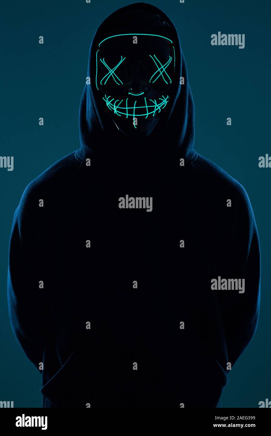 Black man hiding identity behind mask hi-res stock photography and ...