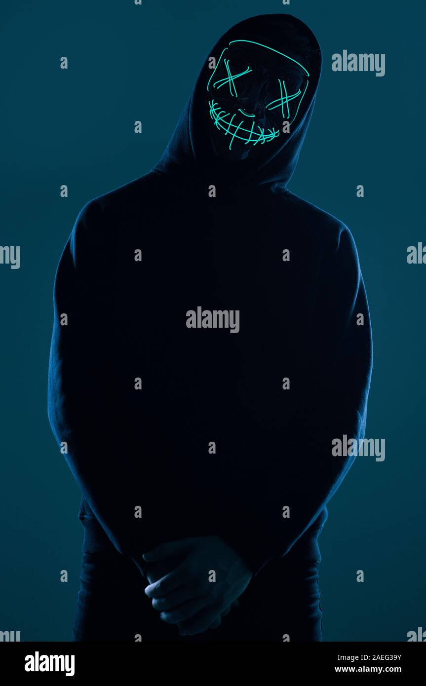 Black man hiding identity behind mask hi-res stock photography and ...