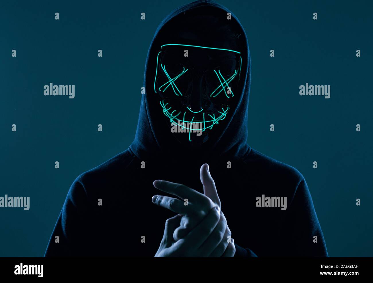 Black man hiding identity behind mask hi-res stock photography and ...