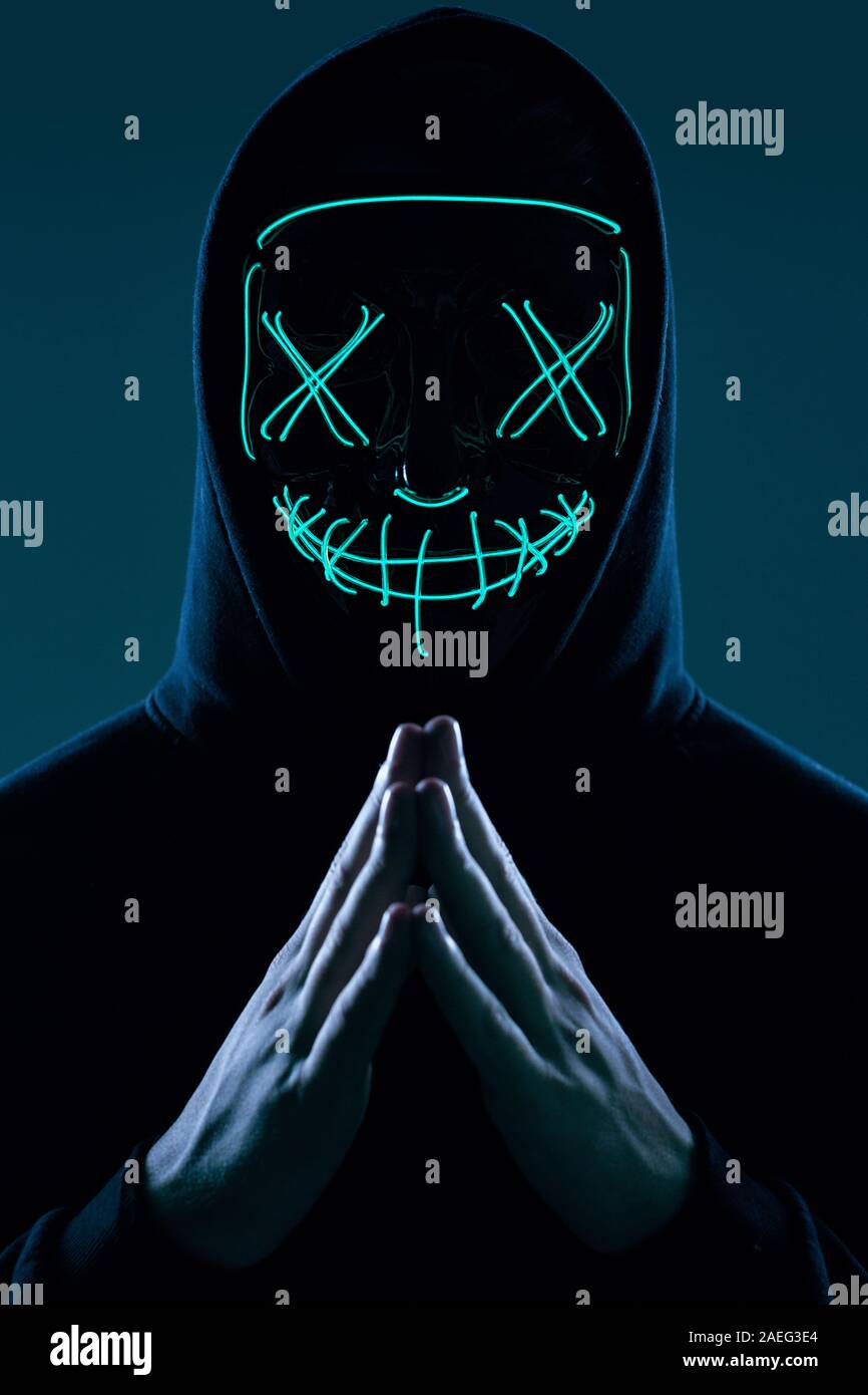 Black man hiding identity behind mask hi-res stock photography and ...