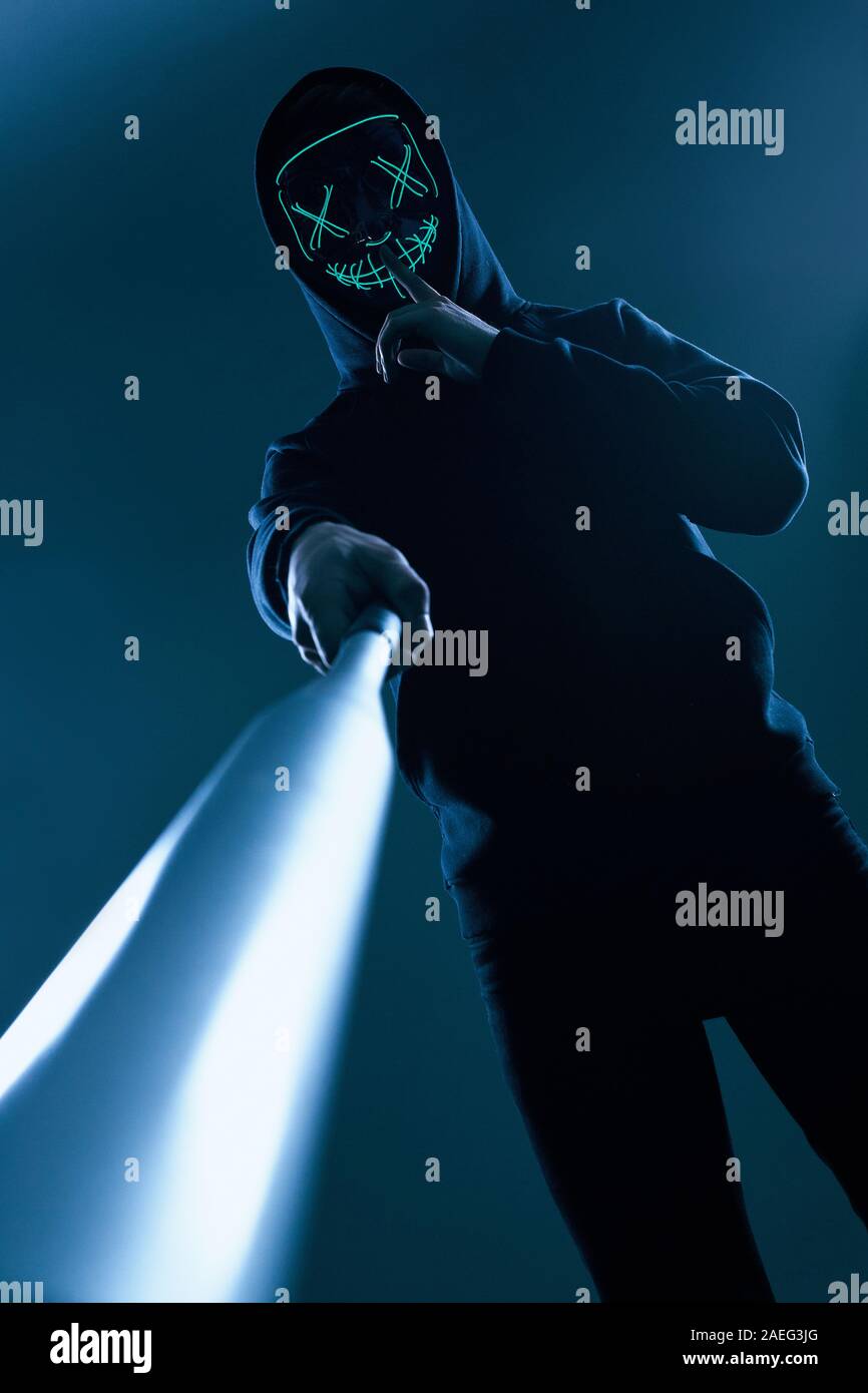 Black man hiding identity behind mask hi-res stock photography and ...
