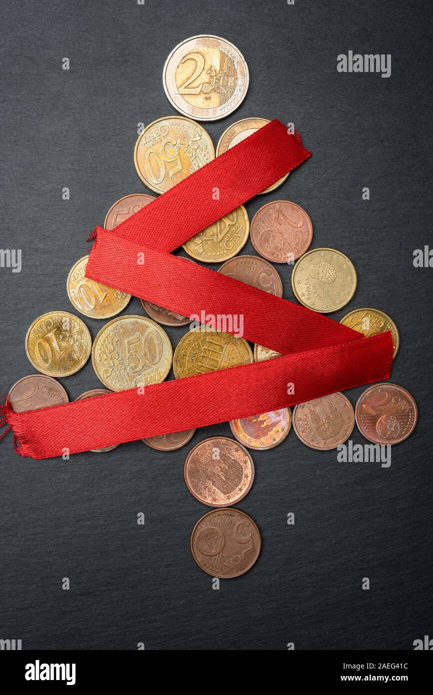 Christmas tree made out of Euro coins with red ribbon chain or garland ...