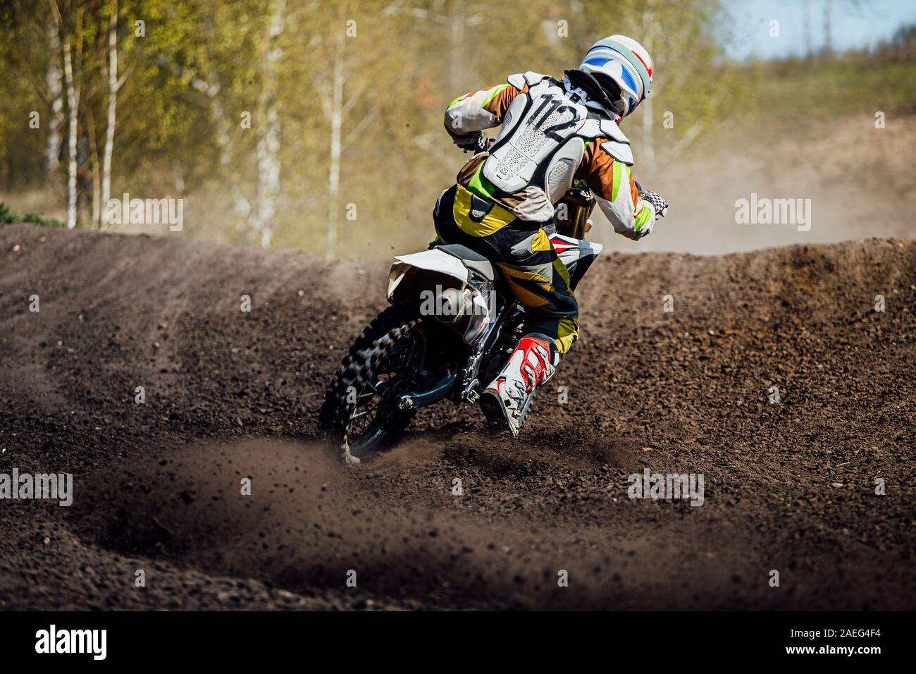 back motocross rider ground and dust from under rear wheel Stock Photo ...
