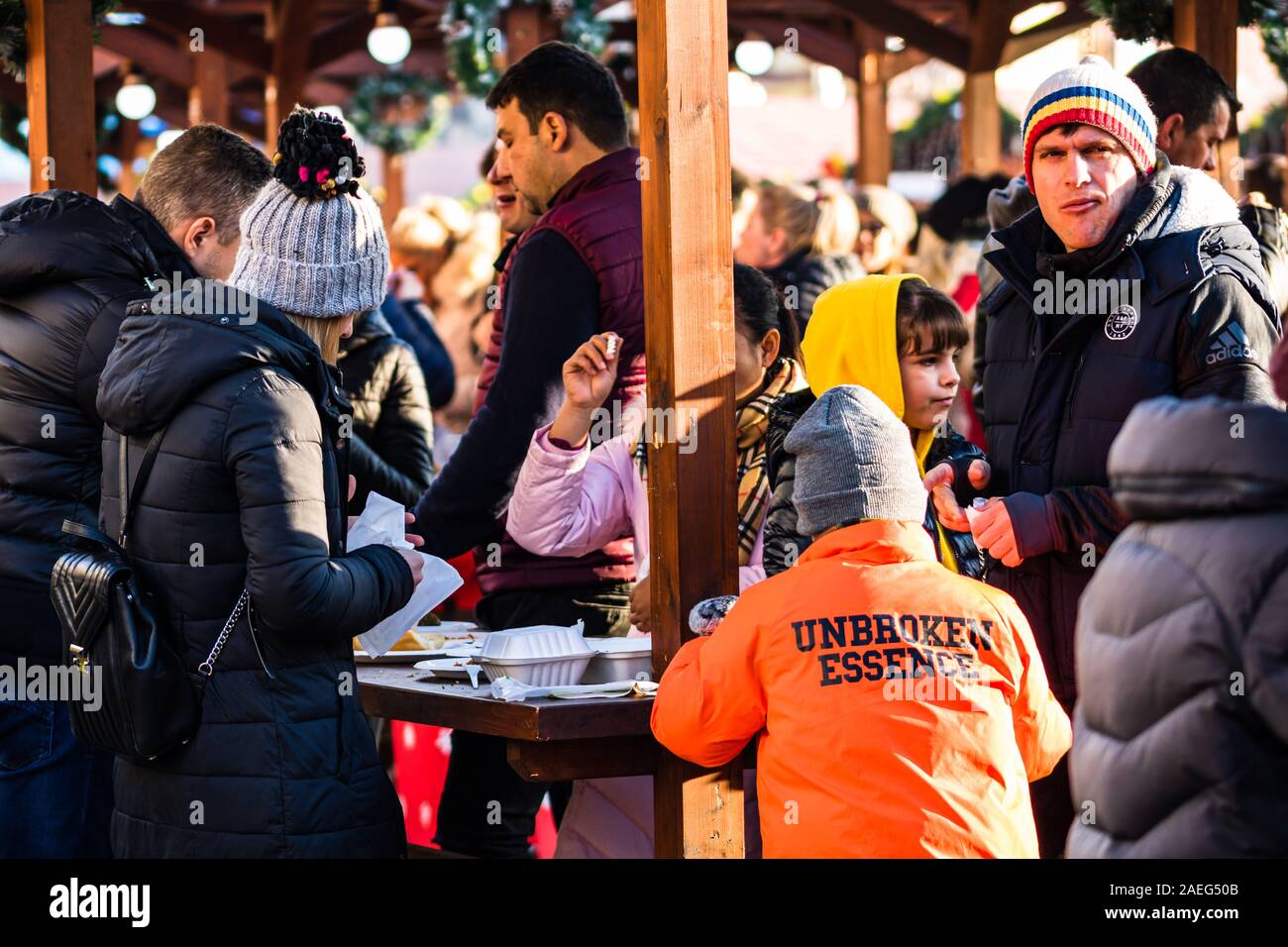 People having lunch with Romanian traditional food at Bucharest ...