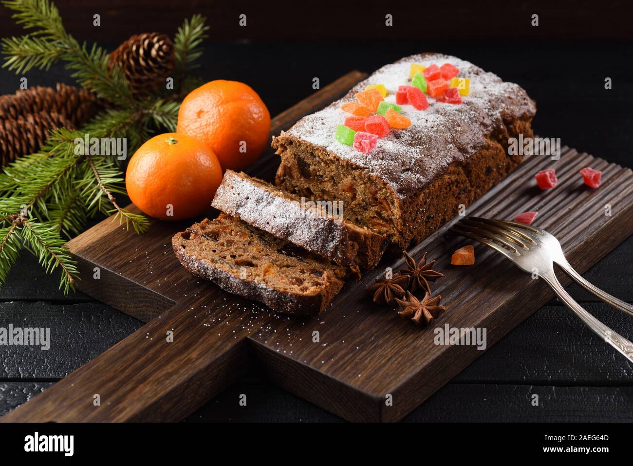 Traditional fruit cake for Christmas served on wooden board with ...