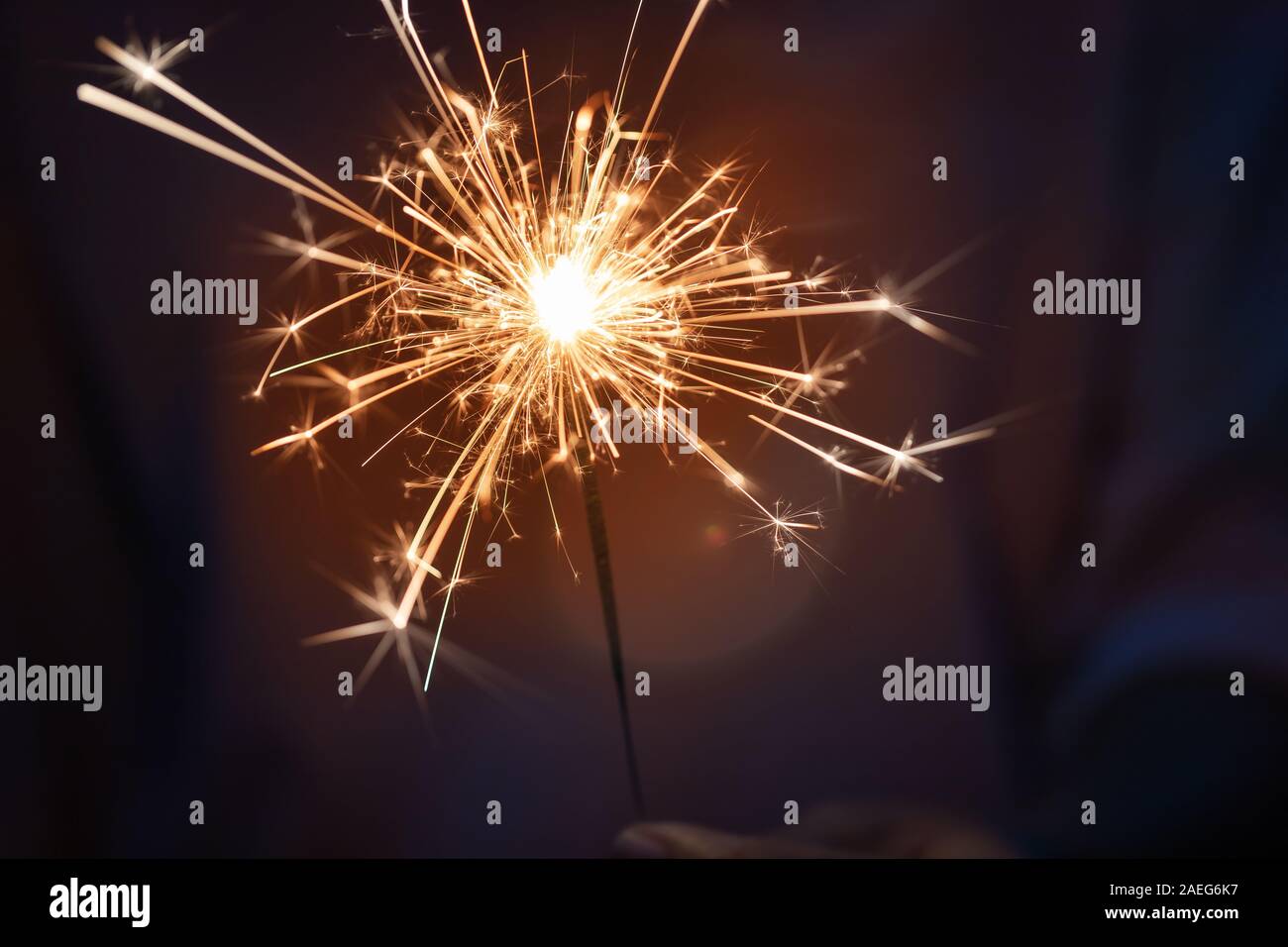 Hand of woman holding firework firework pyrotechnics and bokeh with ...