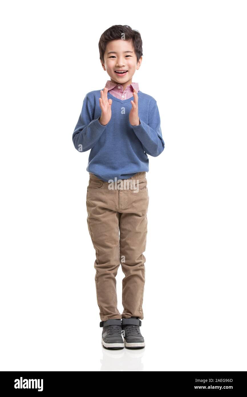 Happy little boy clapping Stock Photo - Alamy