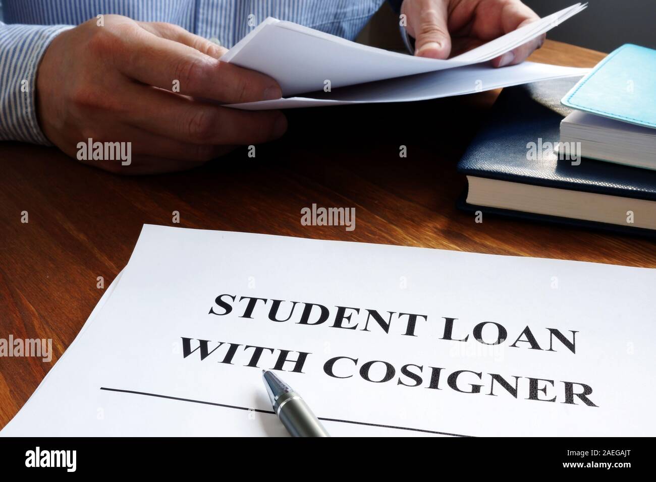 Student loans with cosigner application form and pen Stock Photo - Alamy