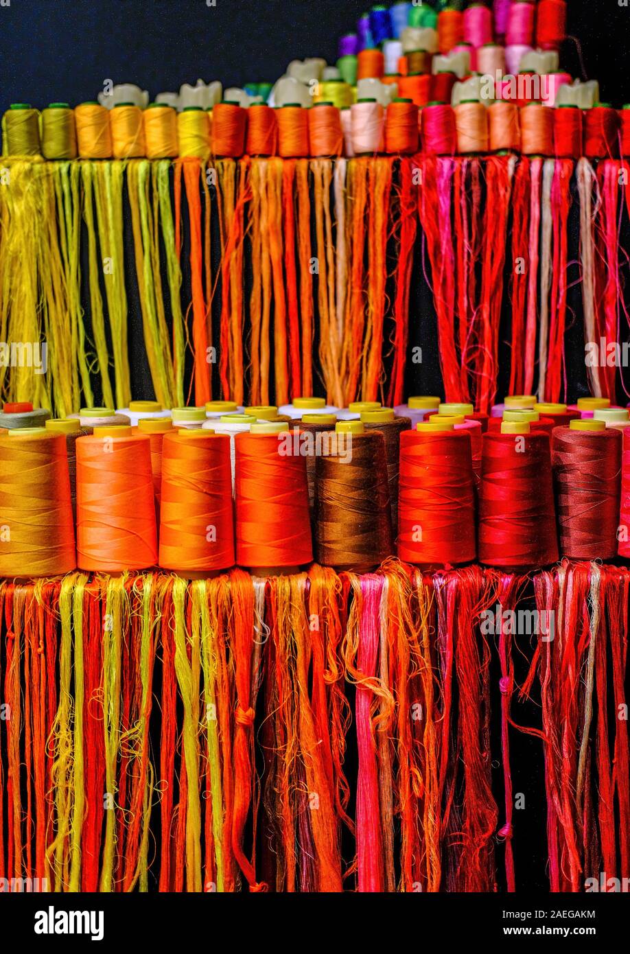 Orange and Yellow Thread on Spools and Strands Stock Photo - Alamy