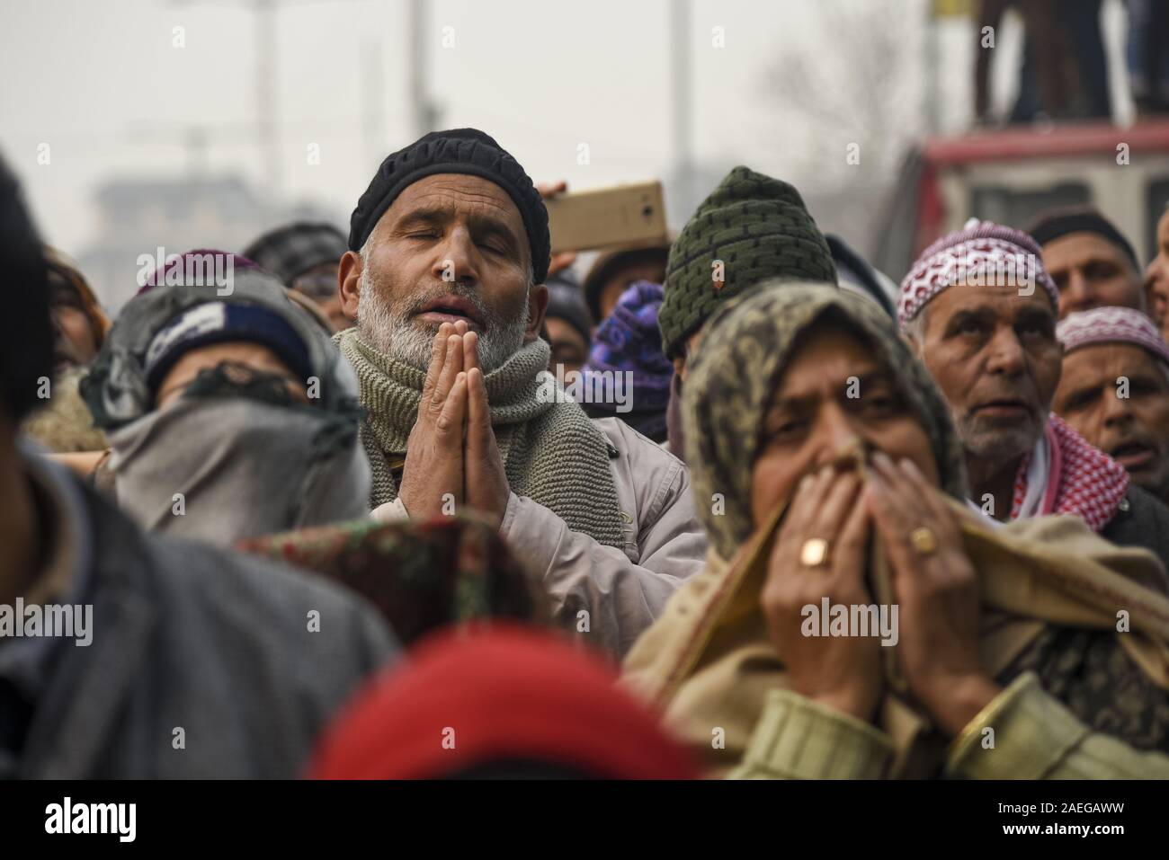 Kashmiri Muslims praying as the head Priest displays the holy relic of ...