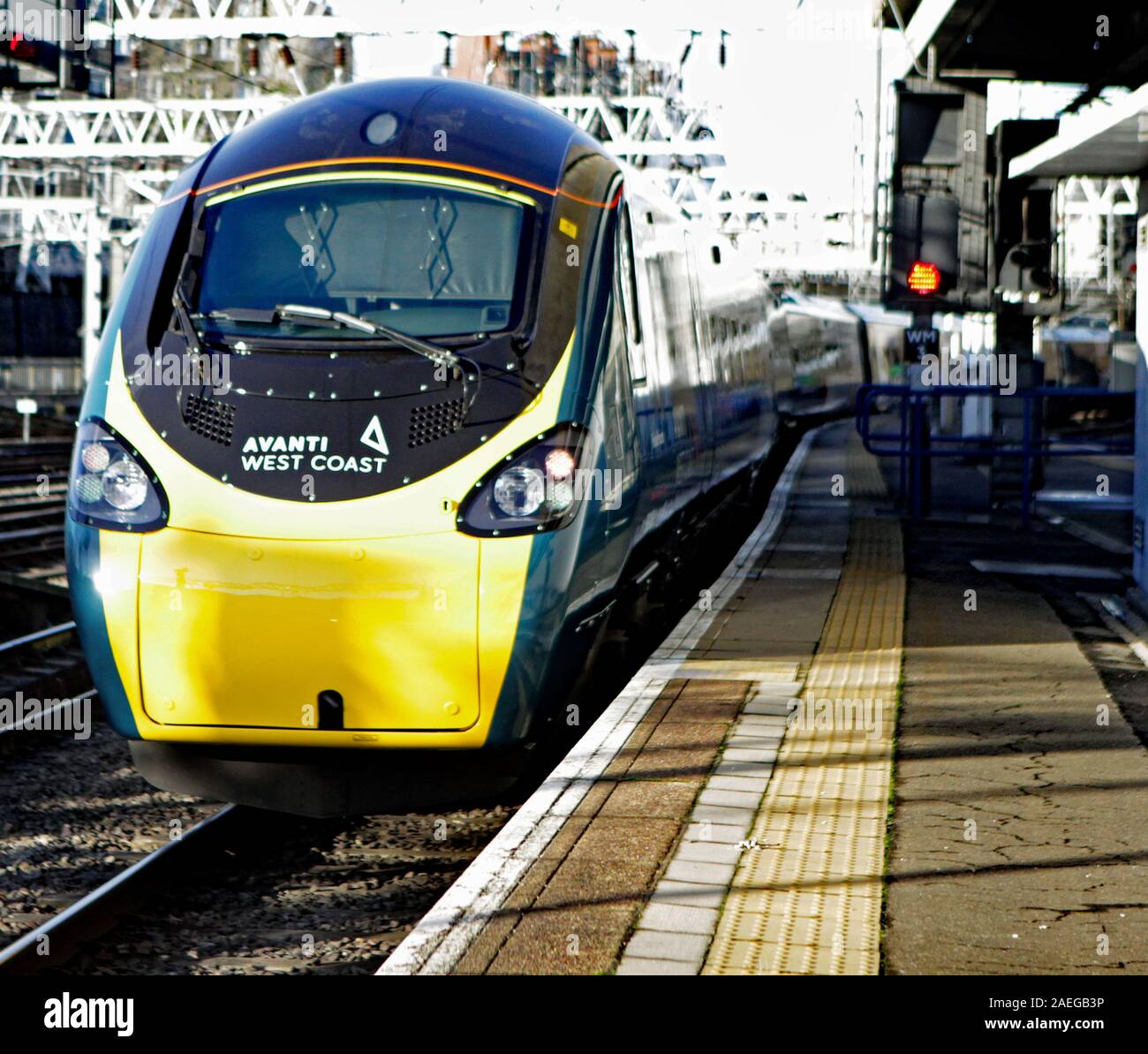Back of an Avanti West Coast train showing the new logo as it departs ...