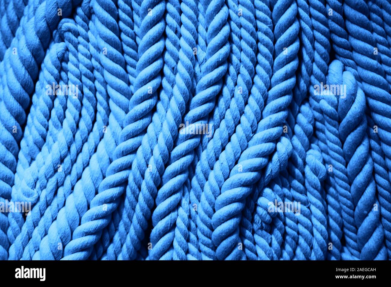 Backdrop made with ropes in blue trendy color Stock Photo - Alamy