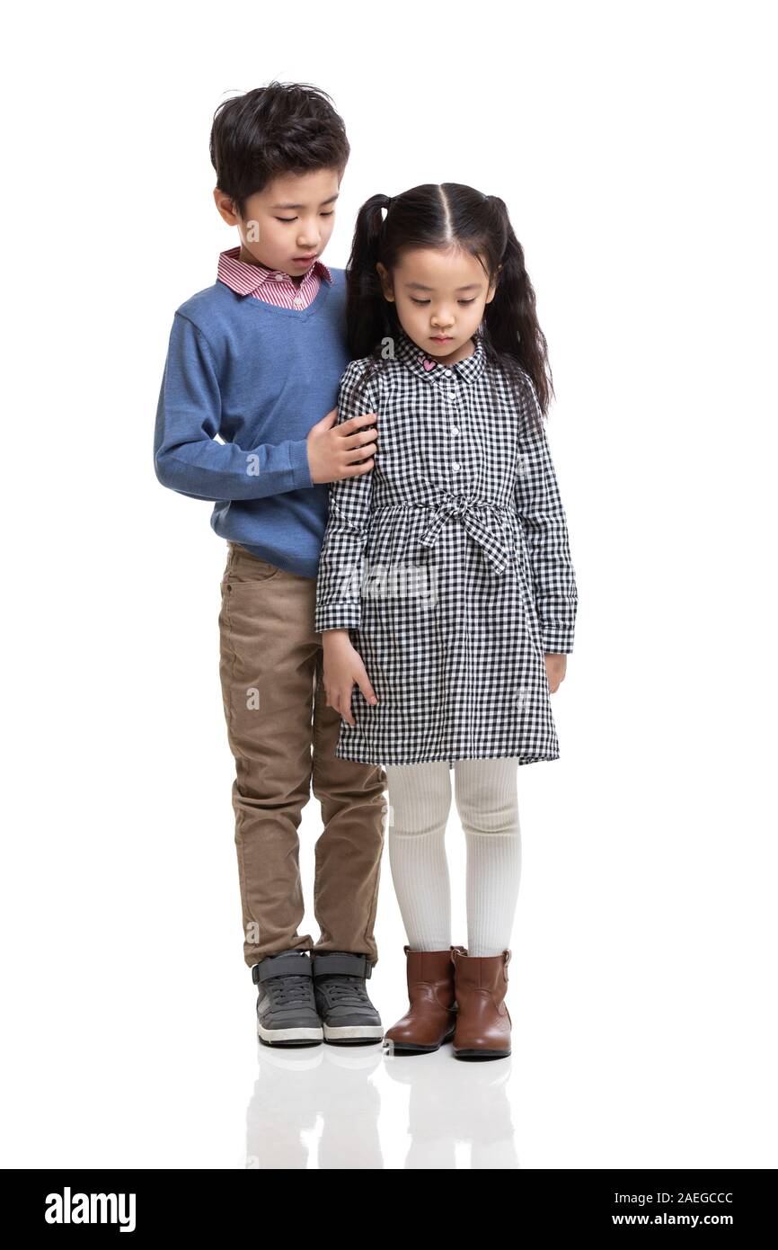 Boy consoling his brother Cut Out Stock Images & Pictures - Alamy