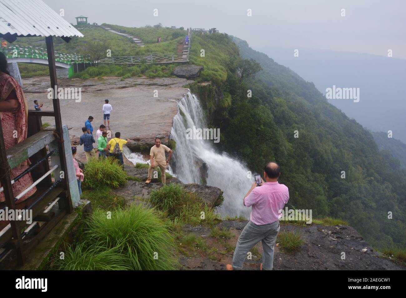Close up of the waterfall of the Eco Park of Cherrapunjee and tourist ...