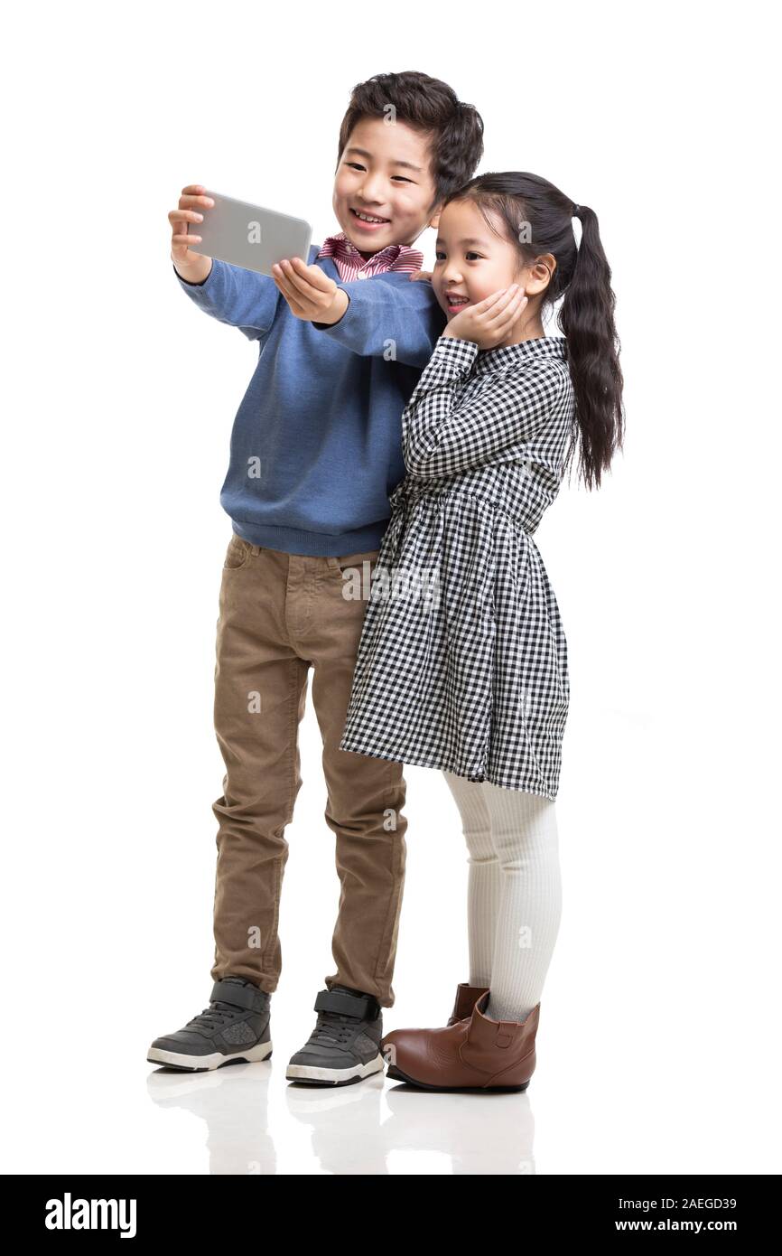 Happy children taking selfie Stock Photo - Alamy