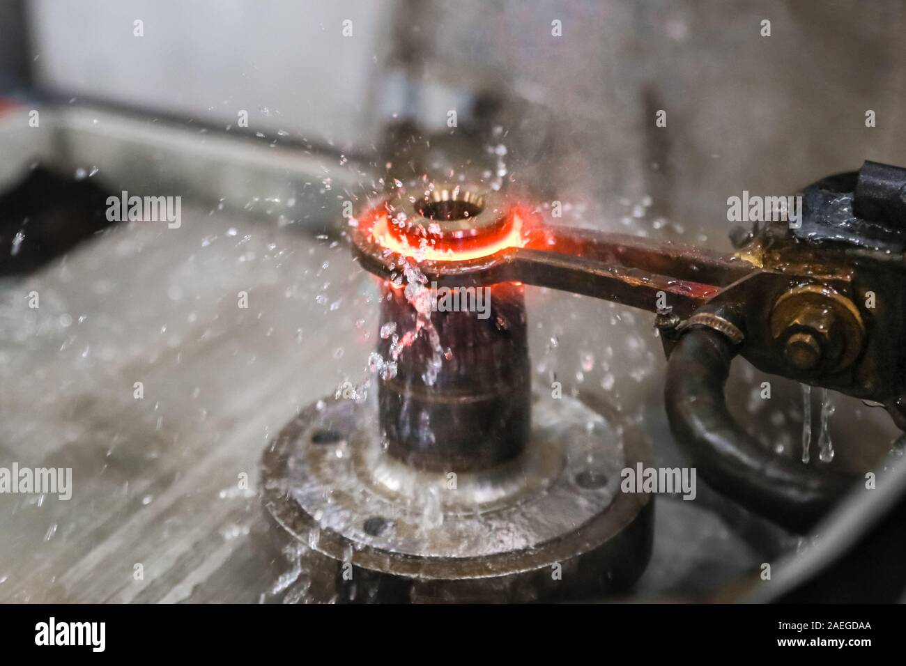 Cooling of metal part with liquid. Technological process Stock Photo ...