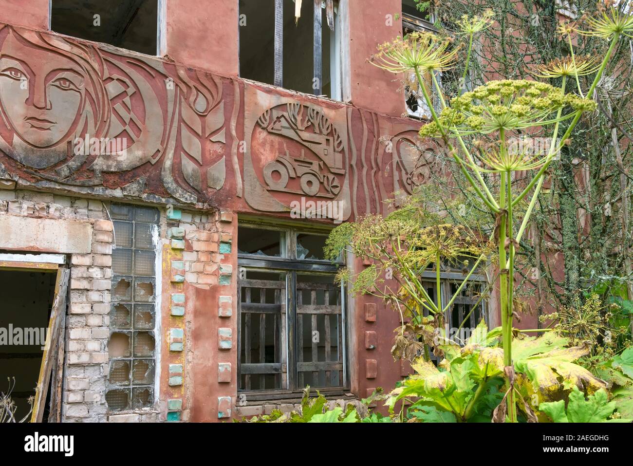 An old abandoned Soviet school building decorated with bas-reliefs from ...