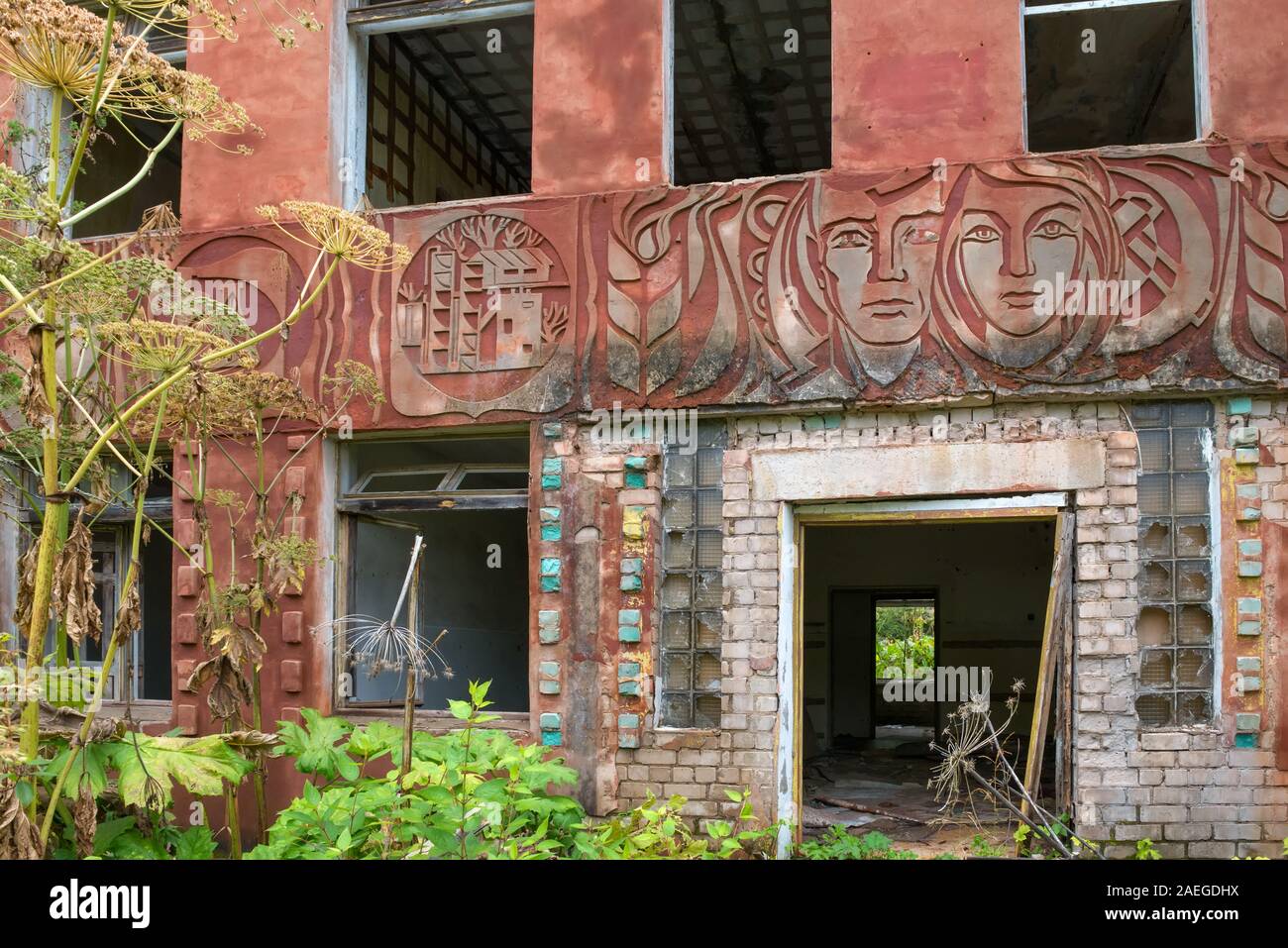 An old abandoned Soviet school building decorated with bas-reliefs from ...