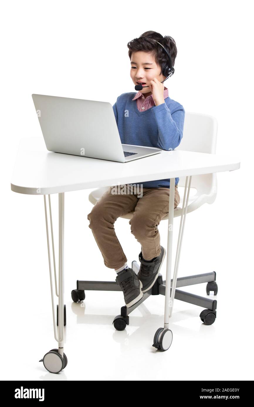 Little boy using laptop Stock Photo - Alamy