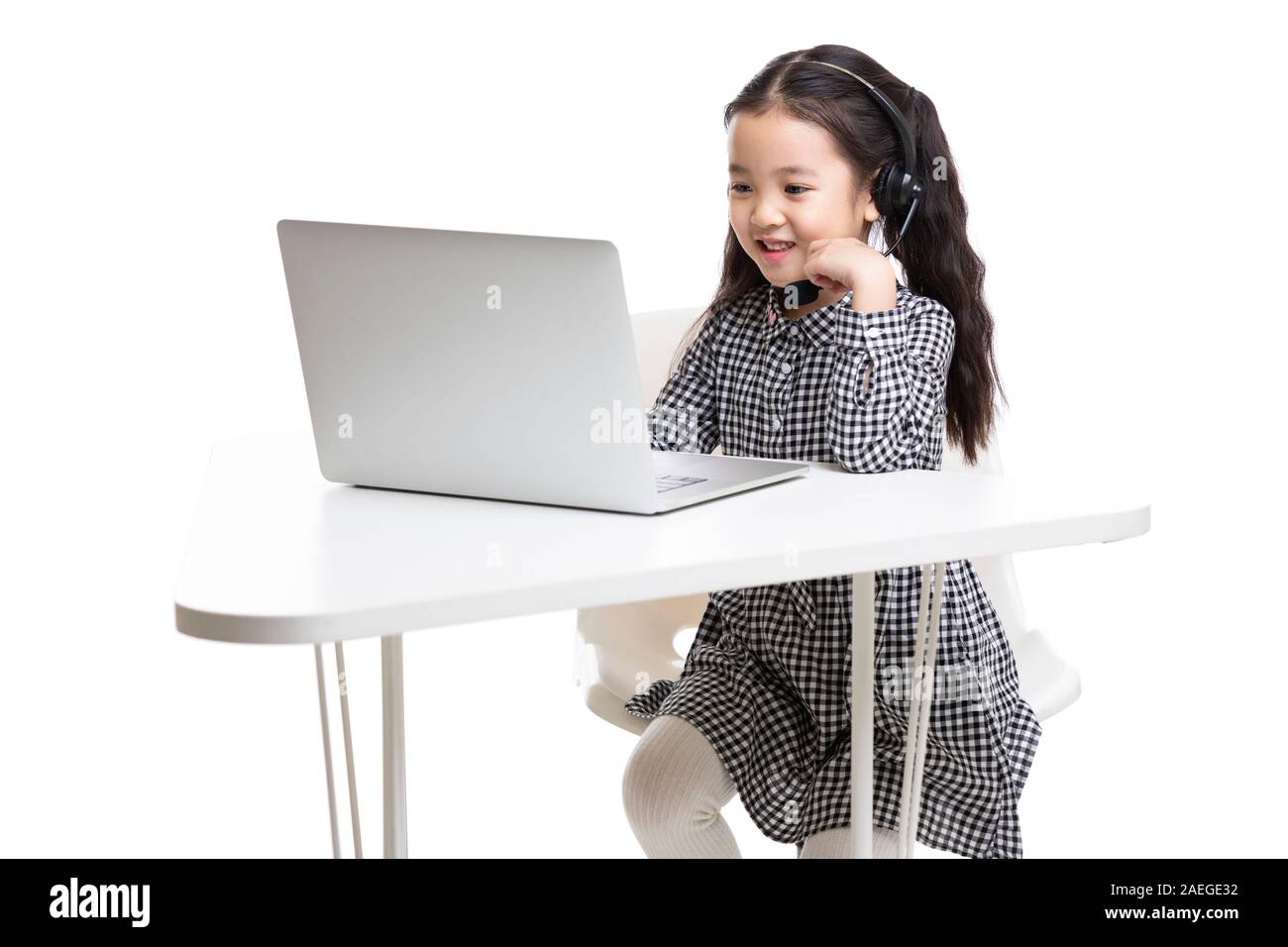Little girl using laptop Stock Photo - Alamy