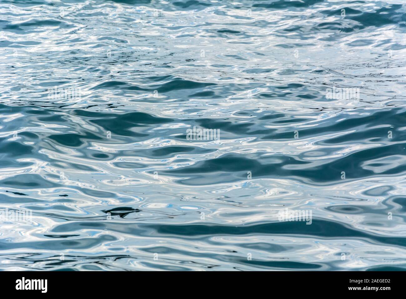 water texture background close up. Bright colorful water reflection ...