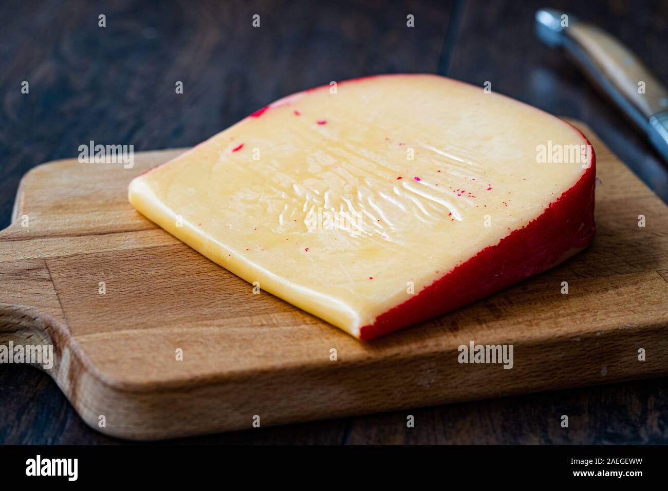 Hard Dutch Gouda Cheese, Close-up on Wooden Board with Knife. Organic ...