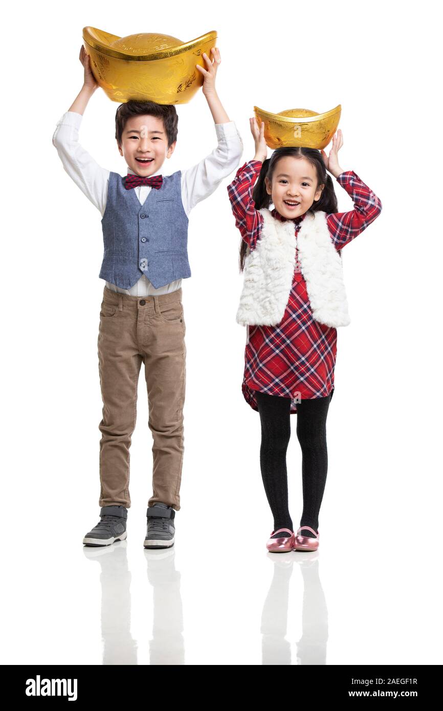 Happy sibling celebrating Chinese New Year Stock Photo - Alamy