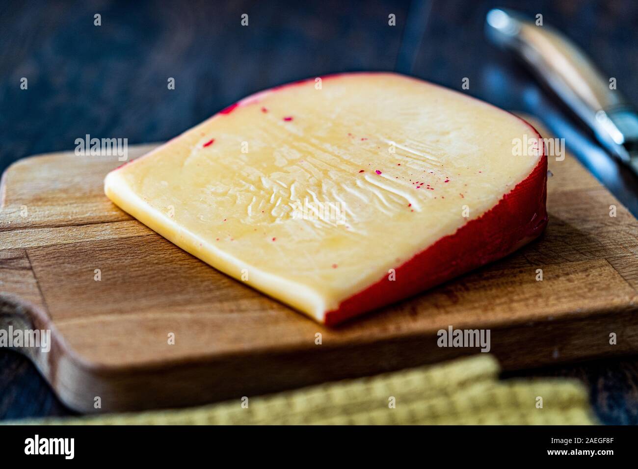Hard Dutch Gouda Cheese, Close-up on Wooden Board with Knife. Organic ...