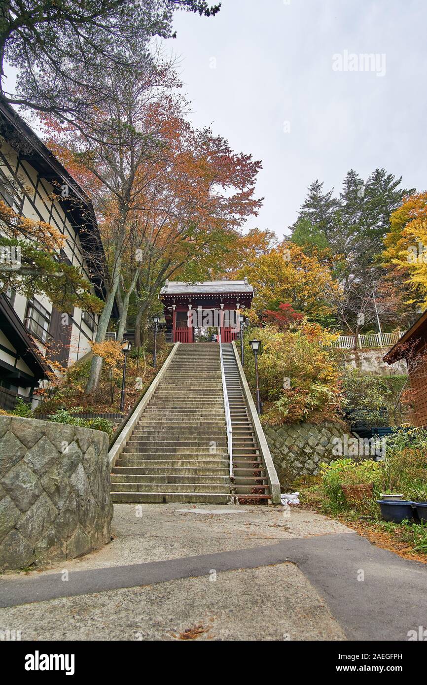 The red Temple gate of Kosenji Temple in Kusatsu, Gunma, Japan, sits at ...