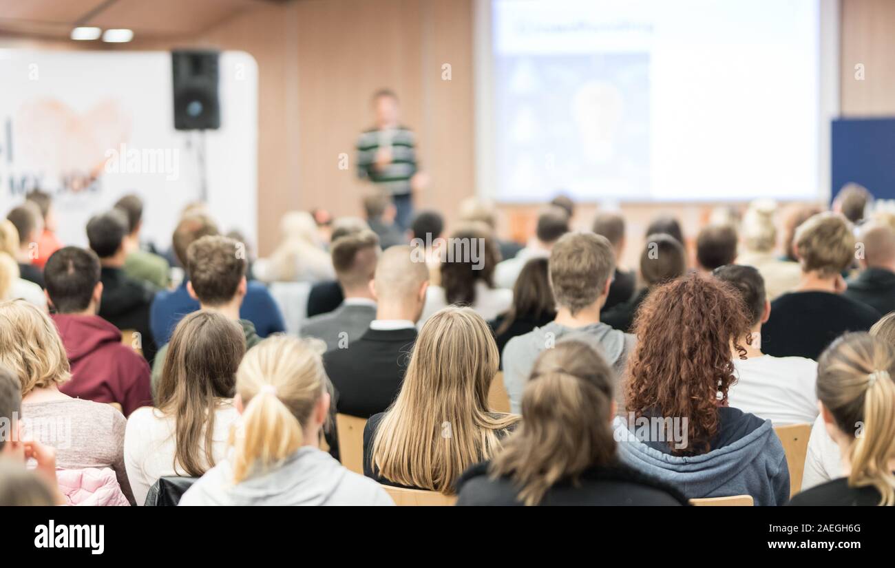 Speaker giving presentation in lecture hall at university Stock Photo ...