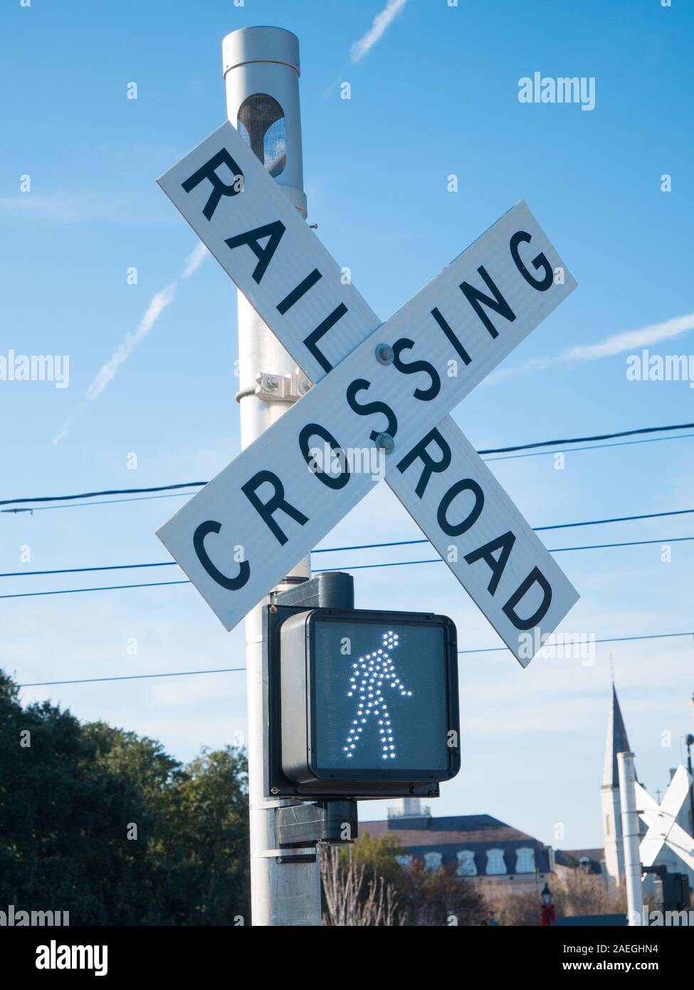 Pedestrian transit train crossing with warning lights Stock Photo - Alamy