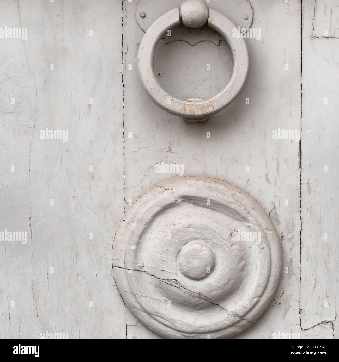 Detail embossed metal handle and an old door Stock Photo - Alamy