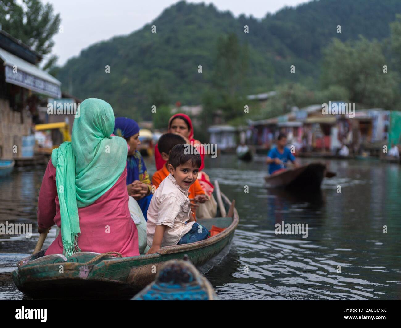 Local kashmiri people using small boat for transportaion in dal Lake ...