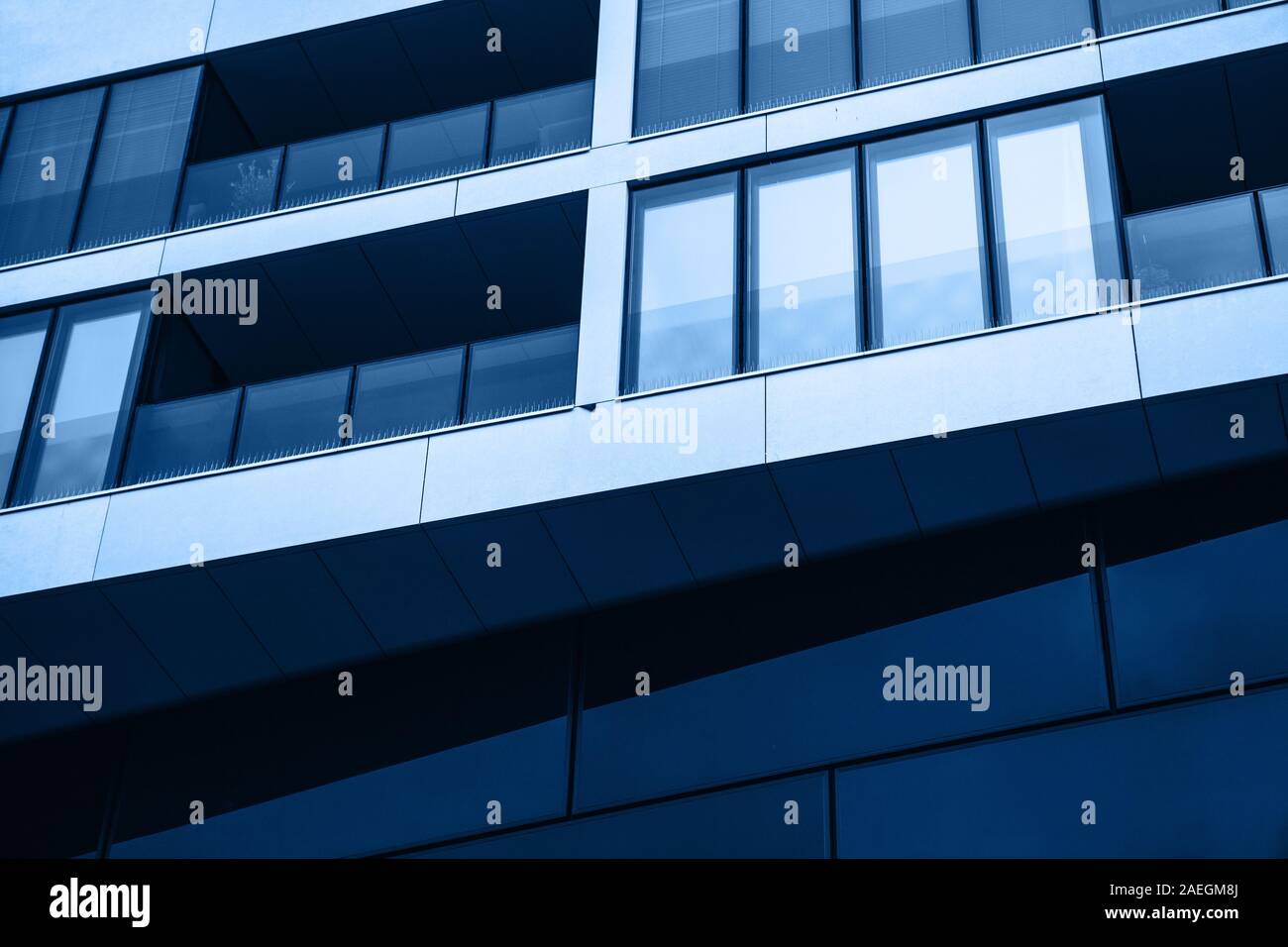 A building with lots of windows in a trendy classic blue color Stock ...