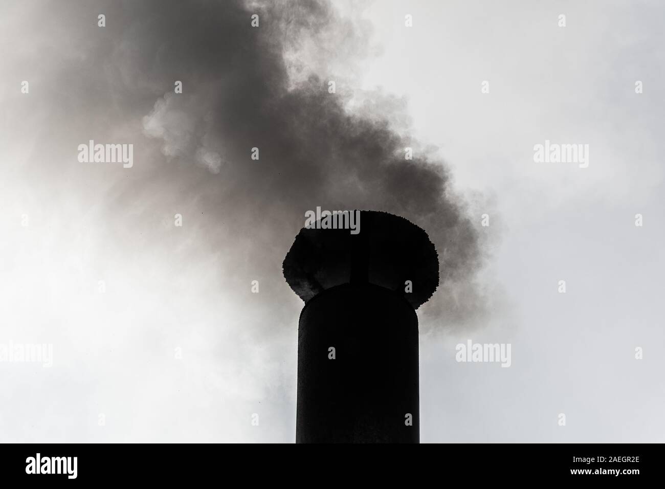 Black smoke coming from the chimney Stock Photo - Alamy