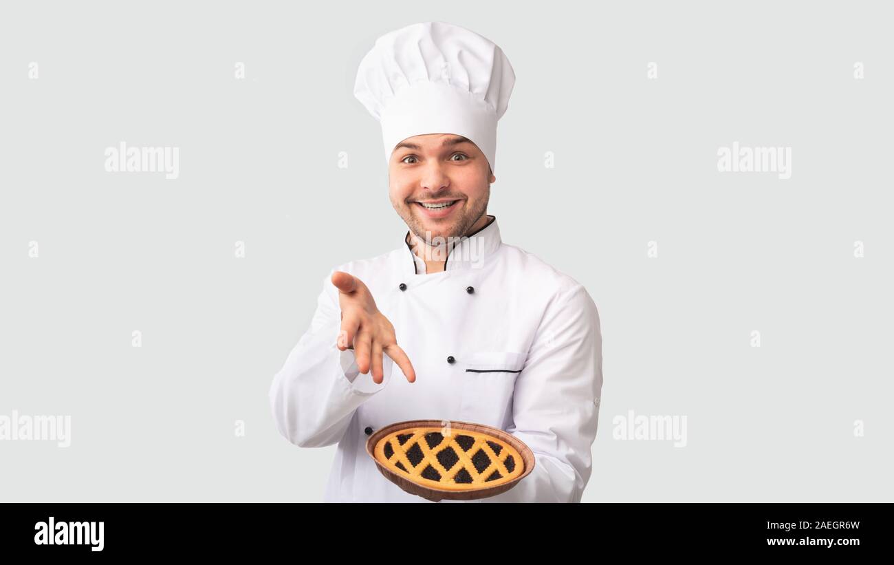 Cheerful Chef Man Showing Pie Standing Over White Studio Background ...